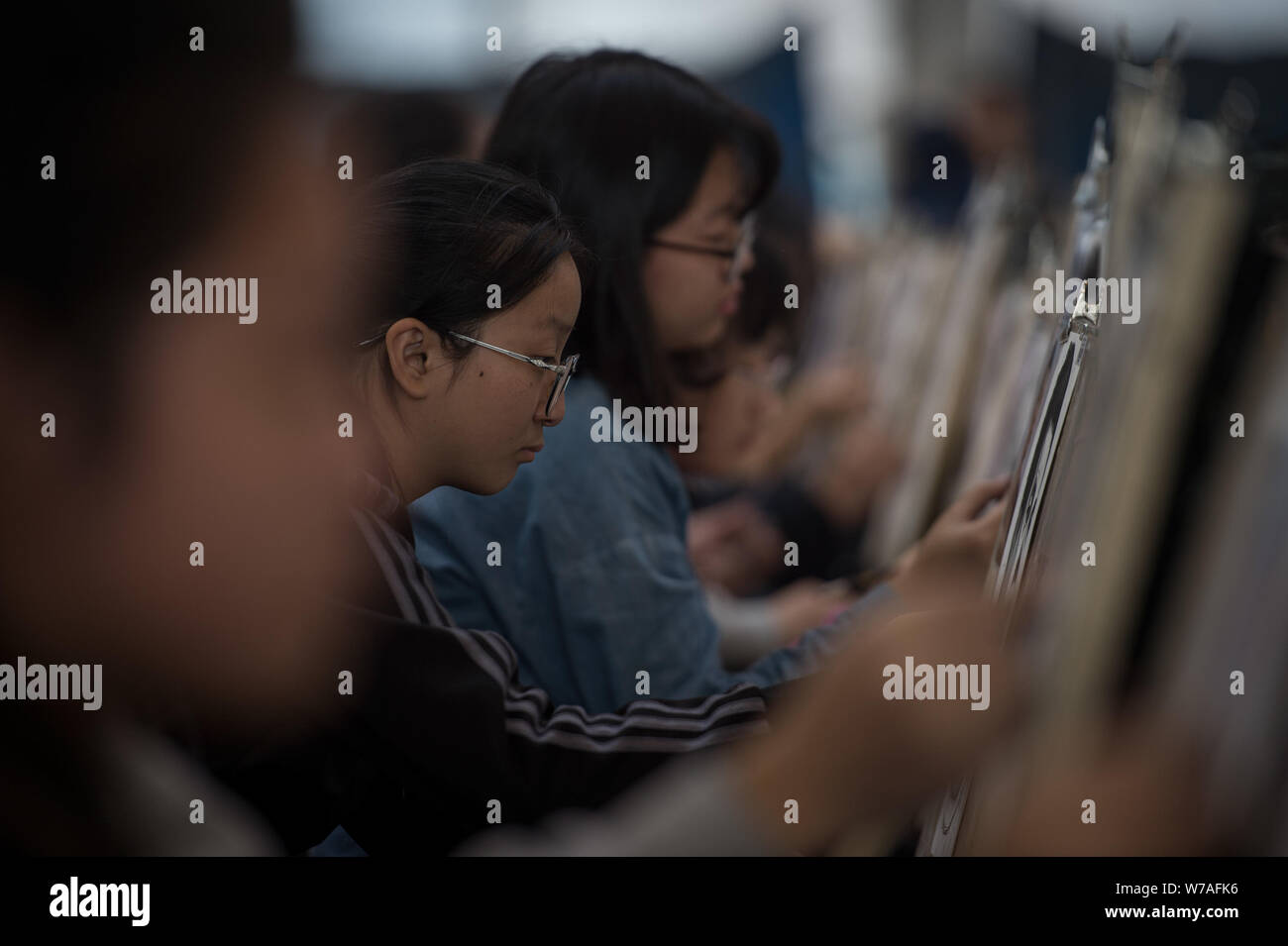 Students take part in a simulation of the entrance examination for the ...