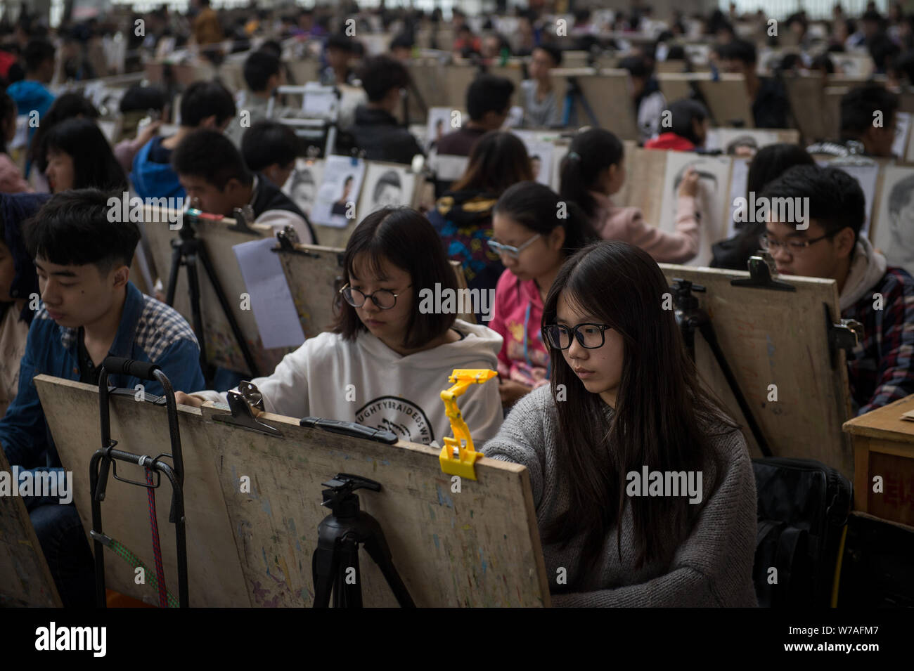 Students take part in a simulation of the entrance examination for the ...