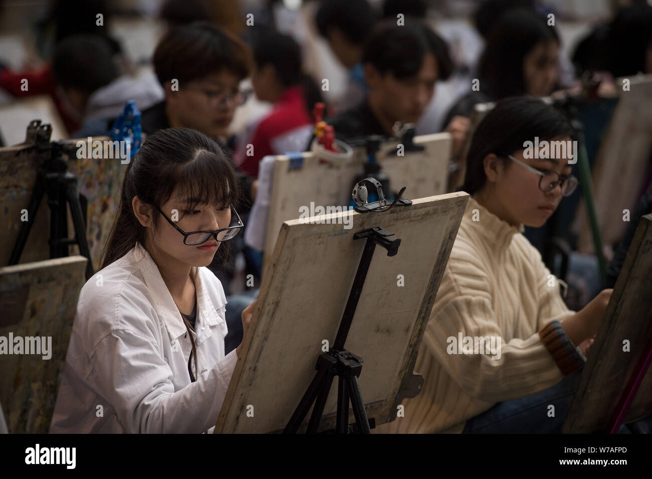 Students take part in a simulation of the entrance examination for the ...
