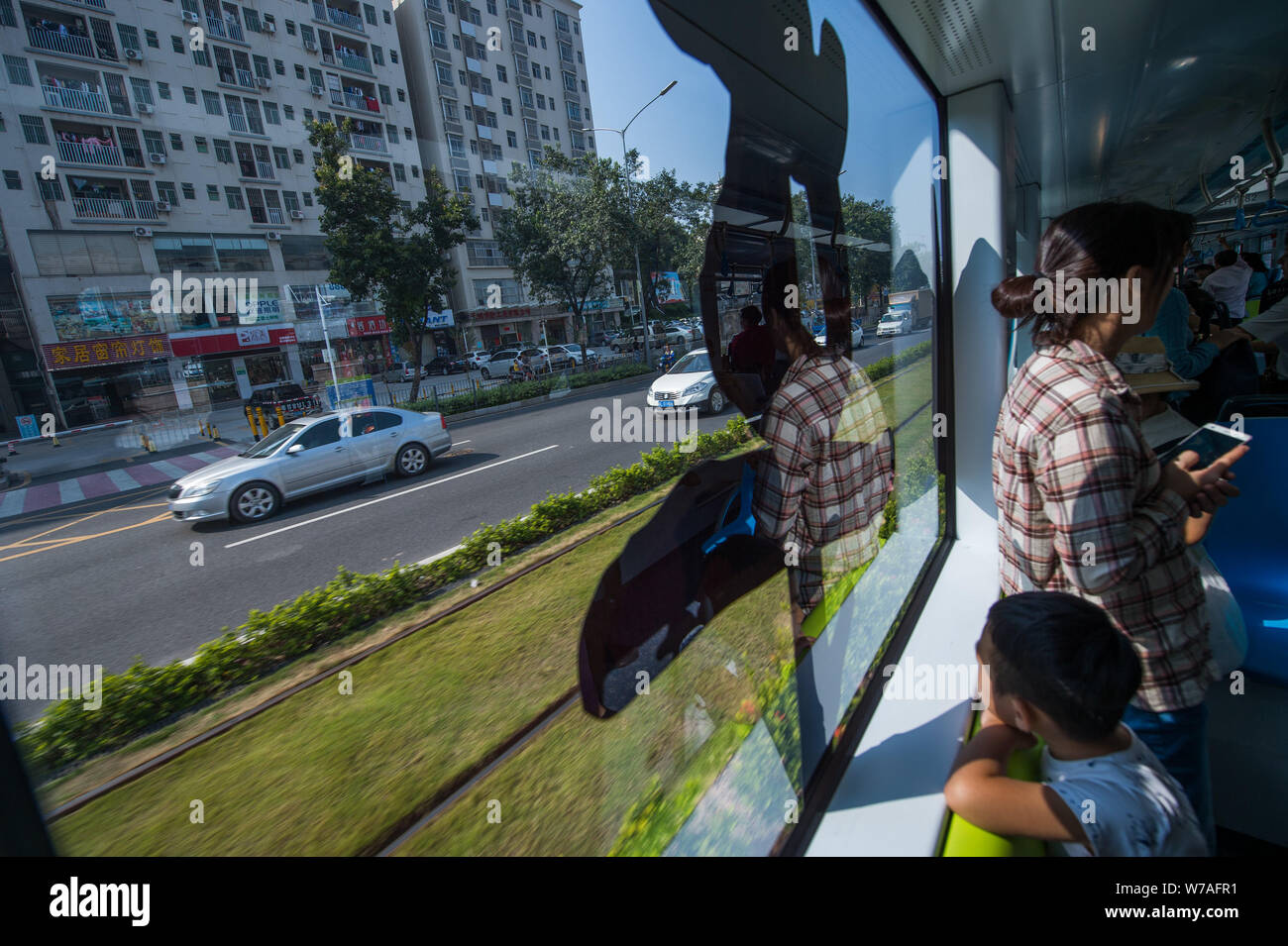 Passengers take a ride in a tramcar on the city's first tram line in ...