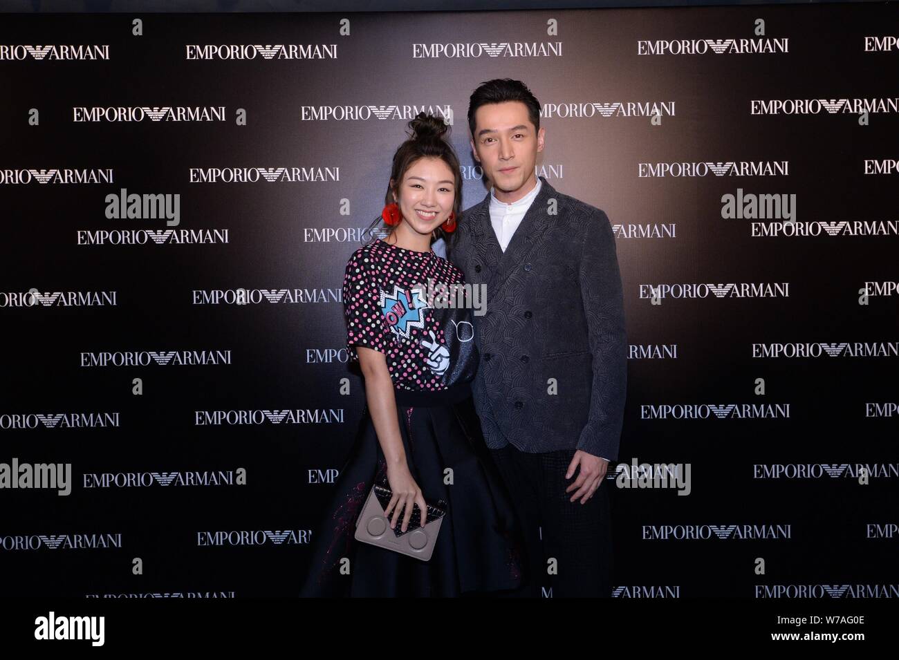 Chinese actor Hu Ge, right, poses as he arrives at a party for Emporio ...
