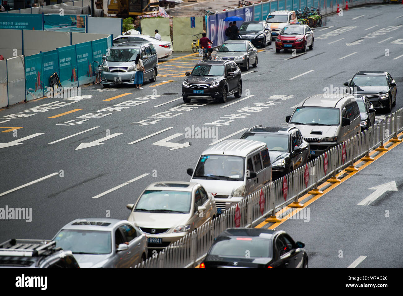 Cars drive through a continuous flow intersection (CFI) at the Caitian ...