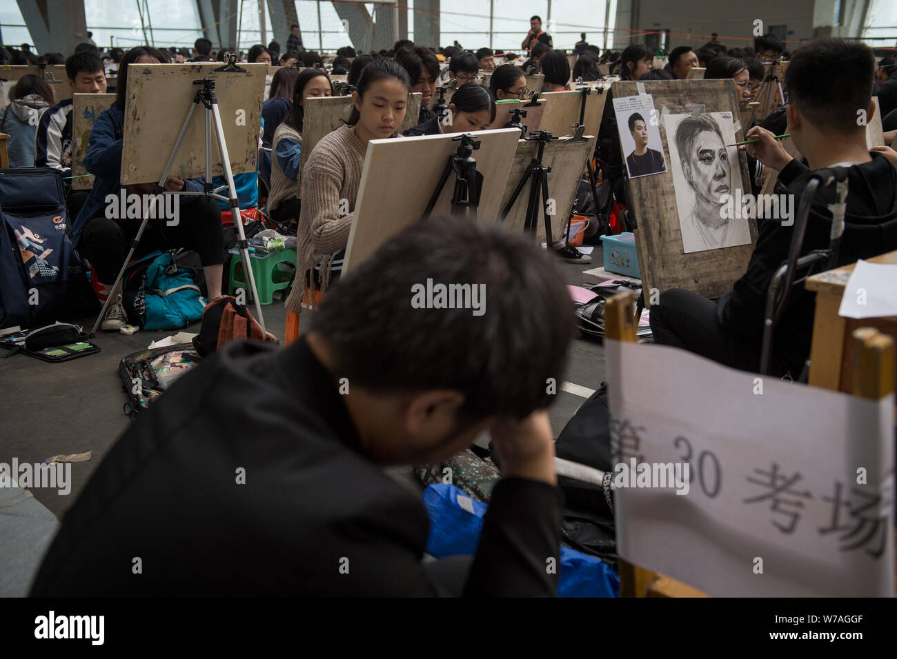 Students take part in a simulation of the entrance examination for the ...