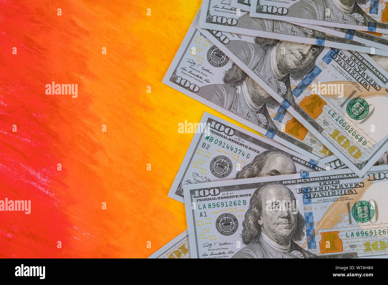 100 dollars banknotes bills on hot orange background. Money, business ...