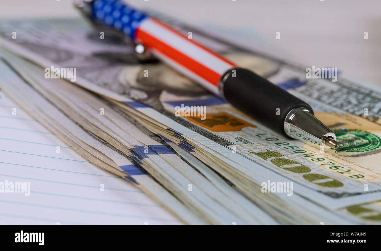 American flag pen and dollars on white table, close-up Stock Photo - Alamy