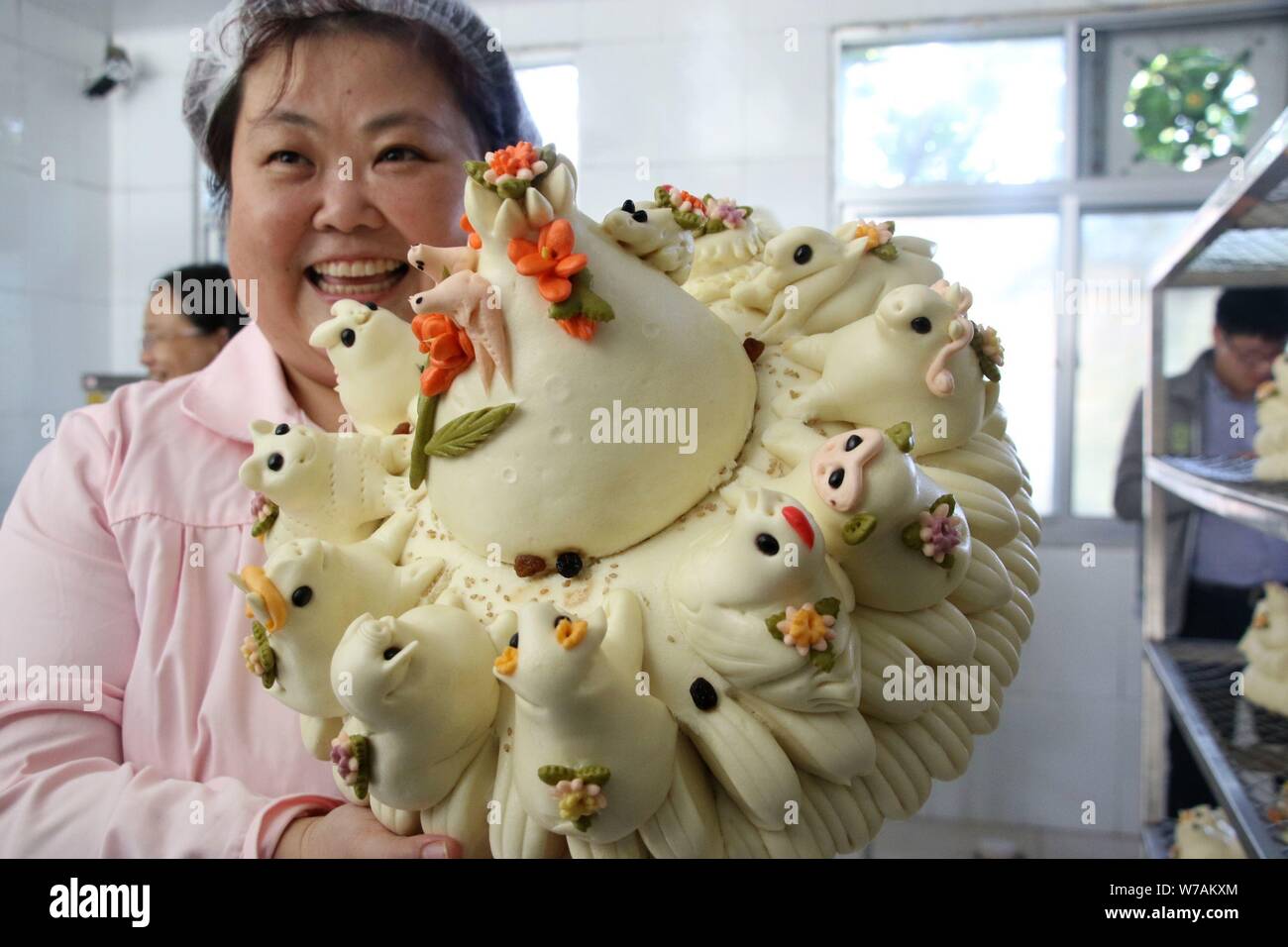 Lin Hong, founder of Chinese steamed bread brand "Jinmaidou", shows a ...