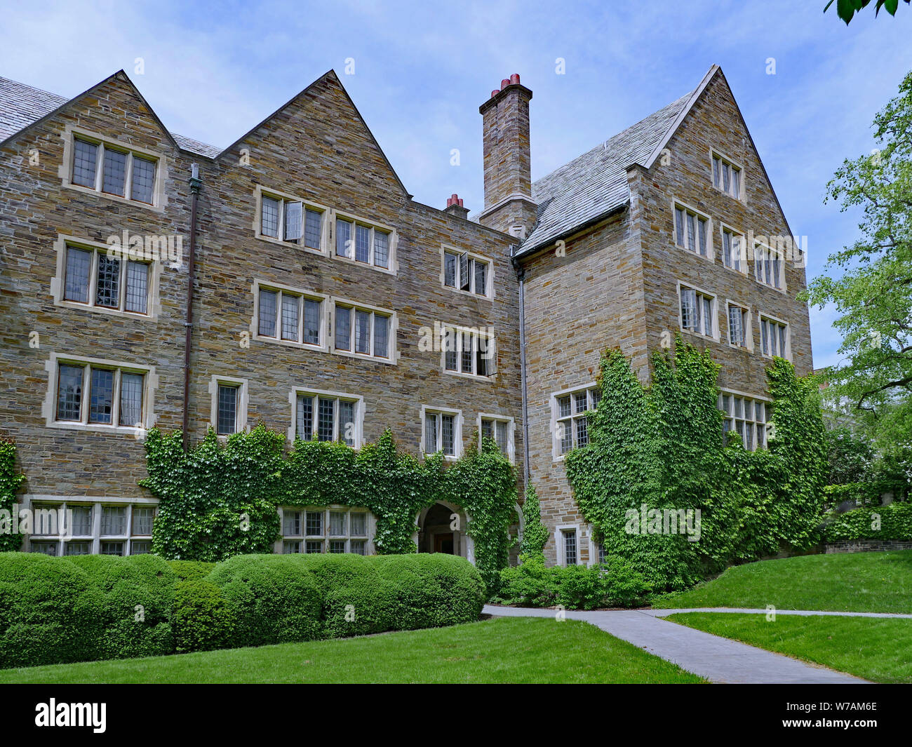 stone gothic style university building with ivy Stock Photo - Alamy
