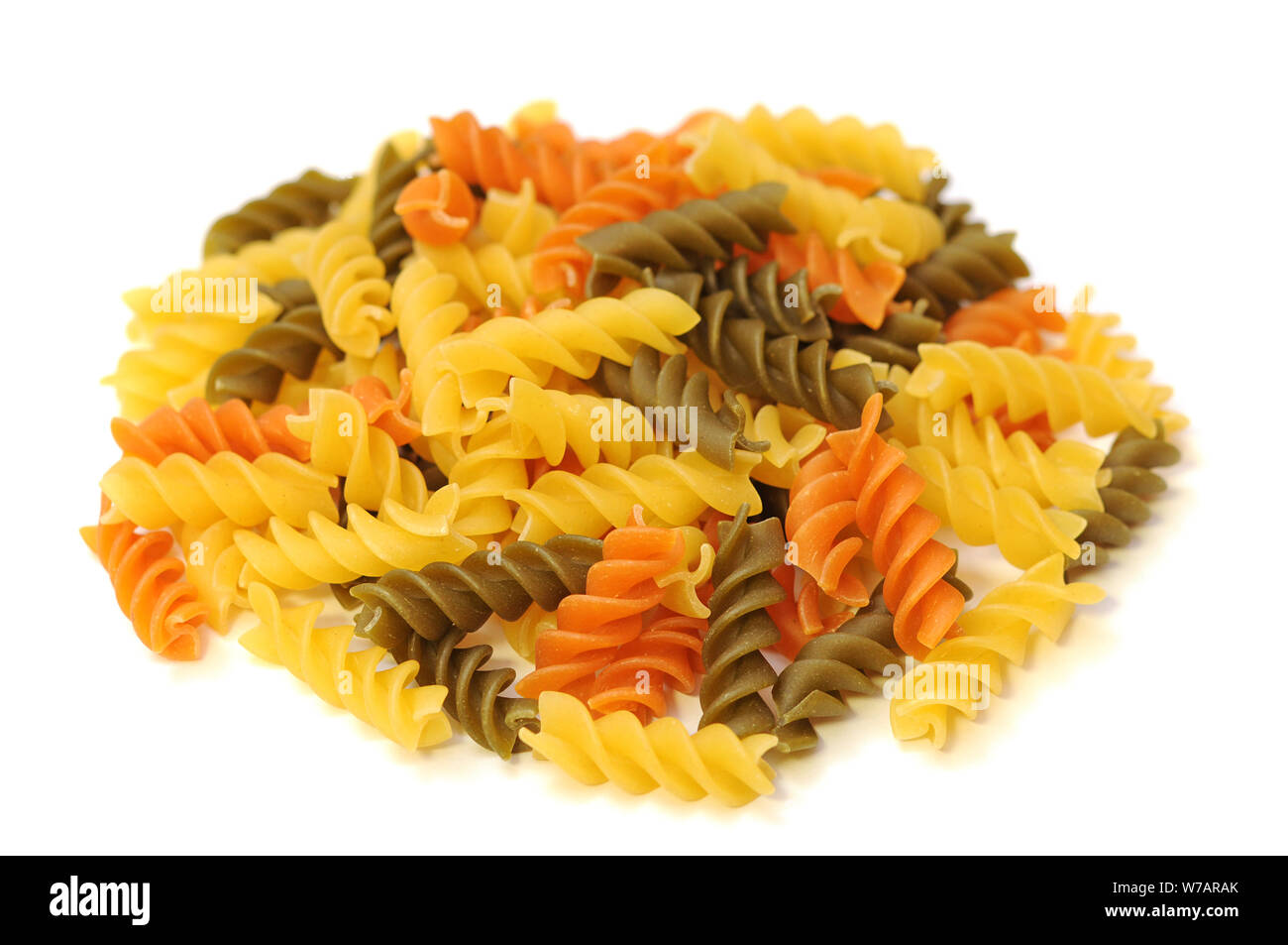 a group of twisted pasta on white background Stock Photo - Alamy