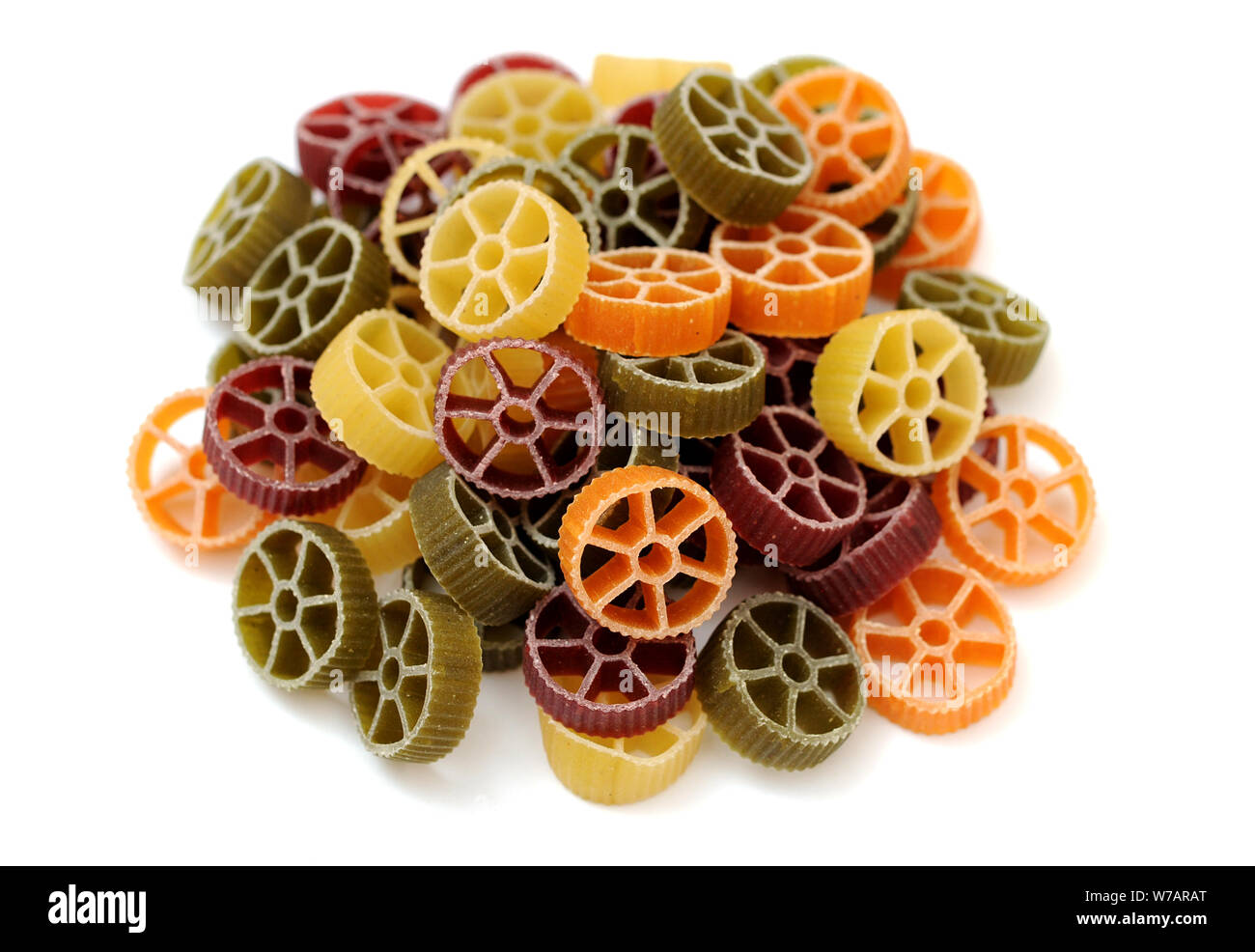 a group of colorful wheel pasta on white background Stock Photo - Alamy