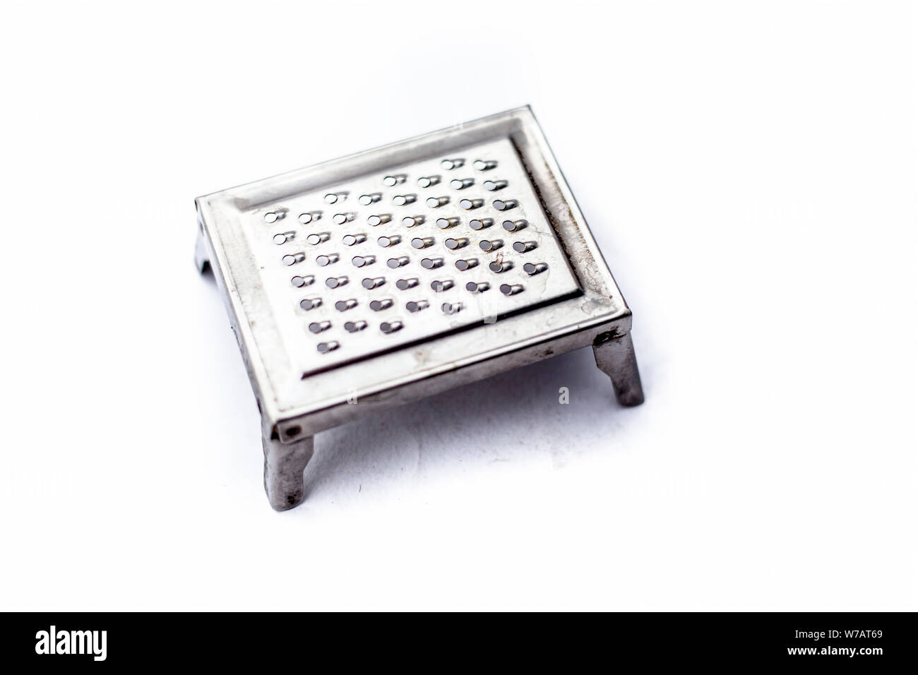 Square shaped cheese or butter grater isolated on white,close up view ...