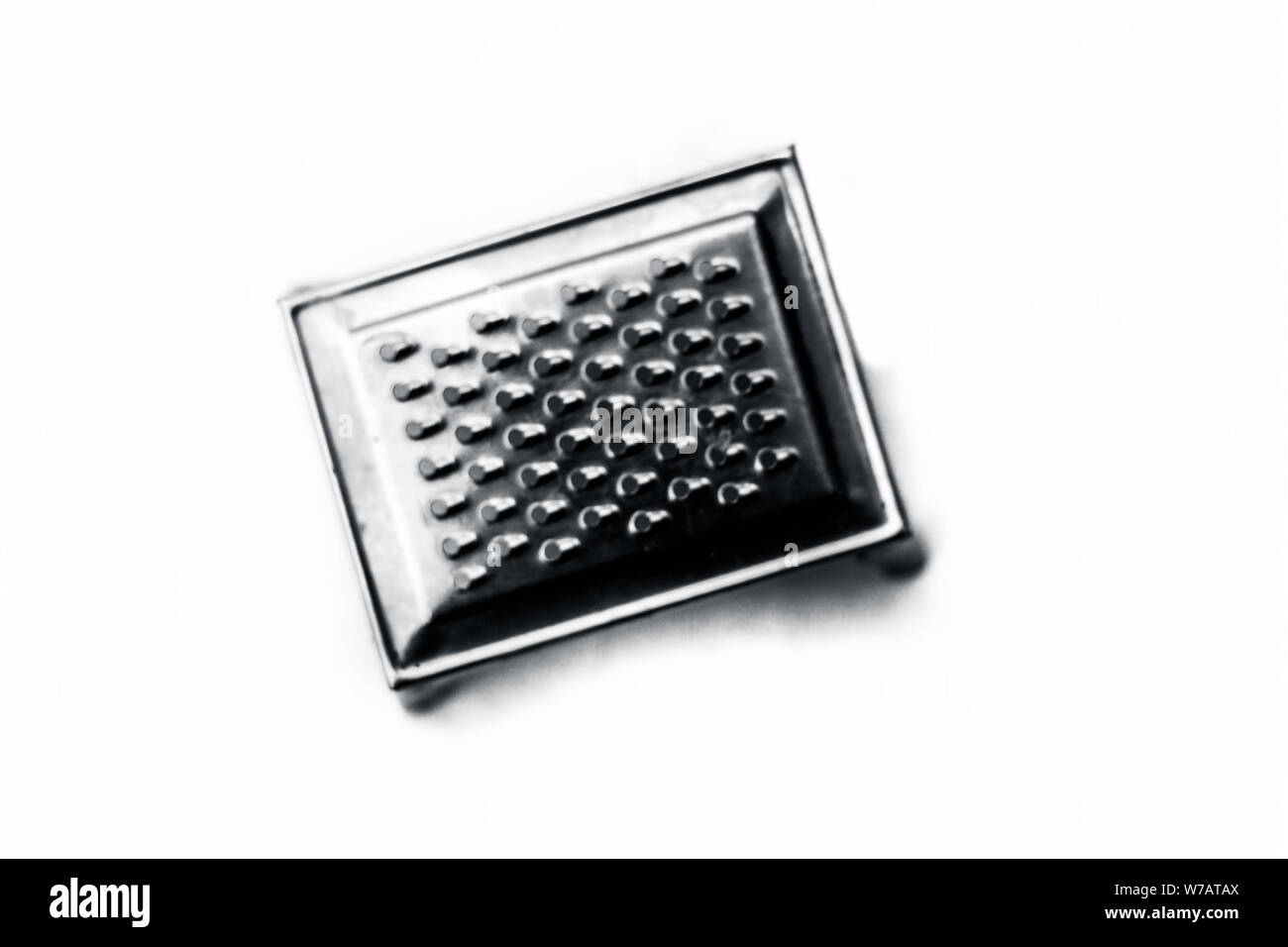 Square shaped cheese or butter grater isolated on white,close up view ...