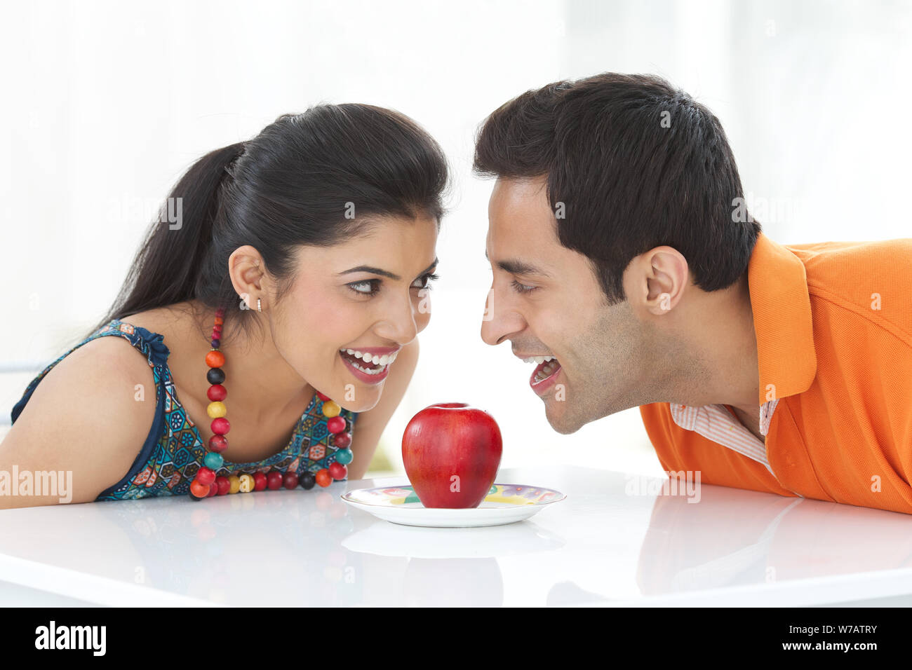 Young man eating tasty apple hi-res stock photography and images - Alamy