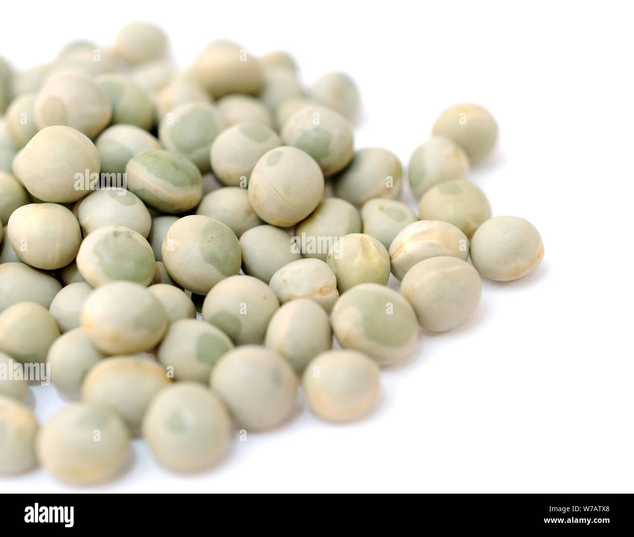 a pile of dried green pea on white background Stock Photo - Alamy