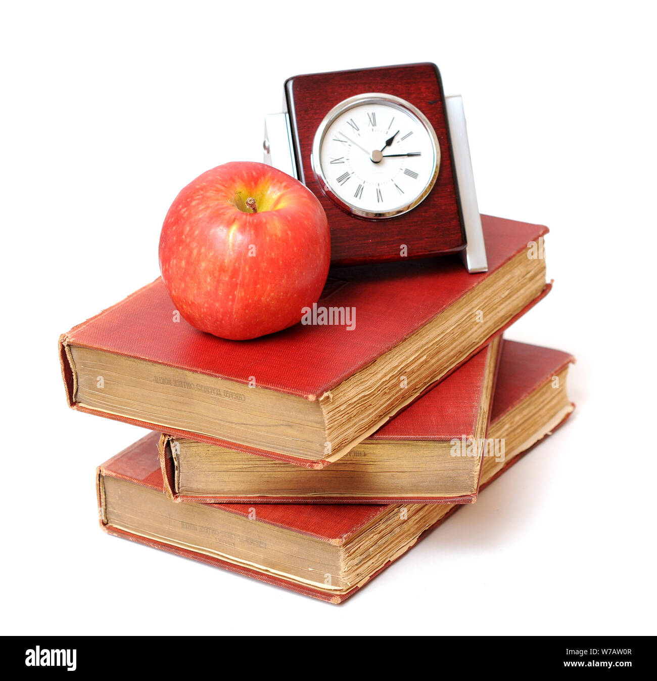 apple, antique books and clock on white background Stock Photo - Alamy