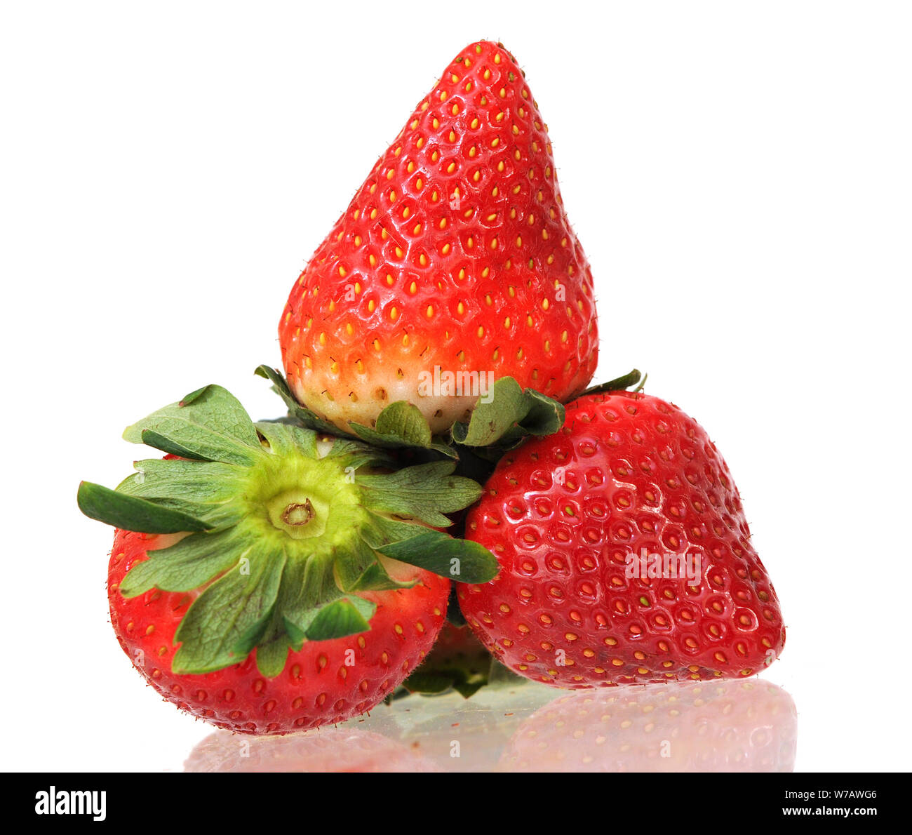three ripe strawberry on white background Stock Photo - Alamy