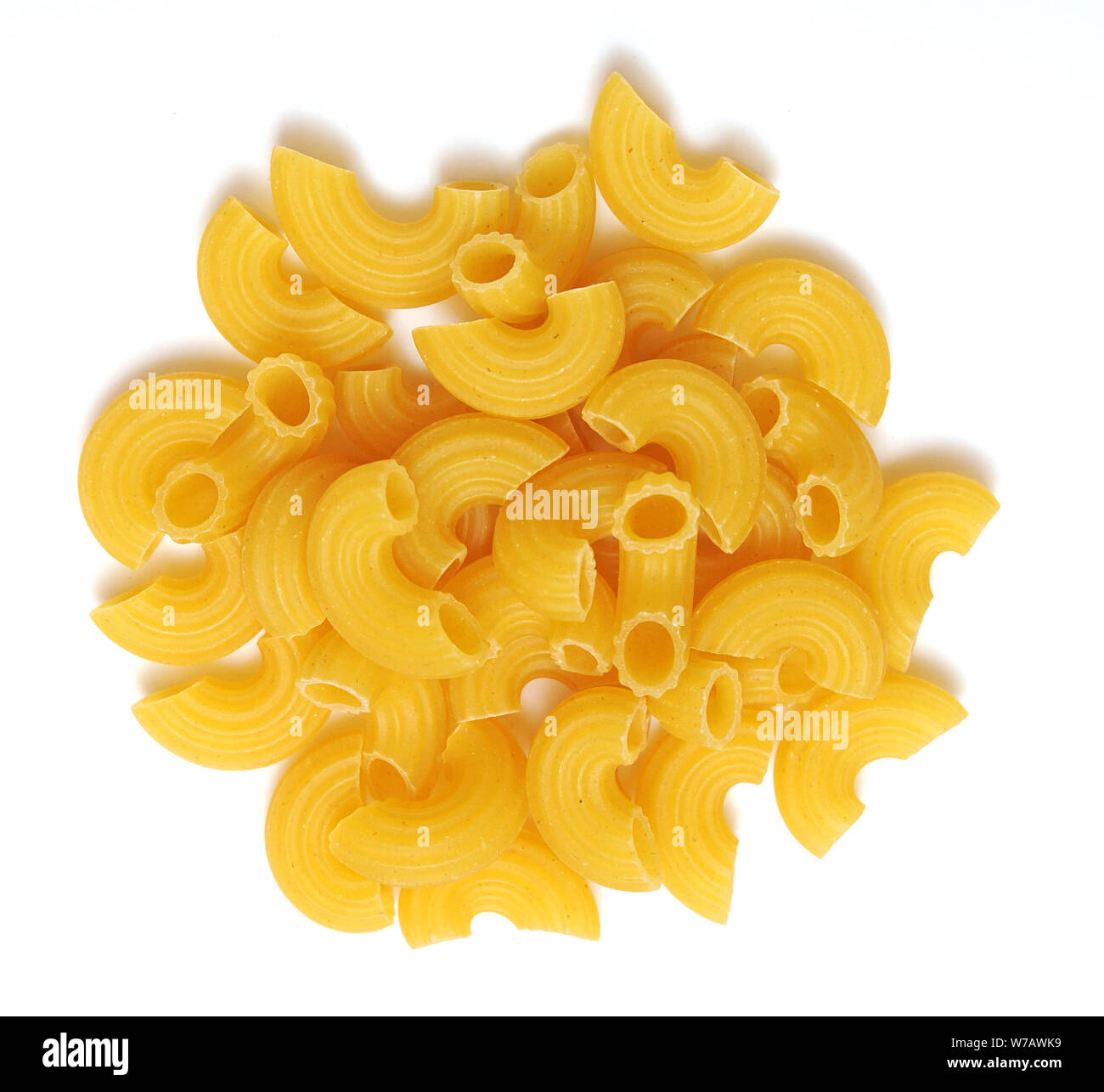 a pile of tube pasta on white background Stock Photo - Alamy