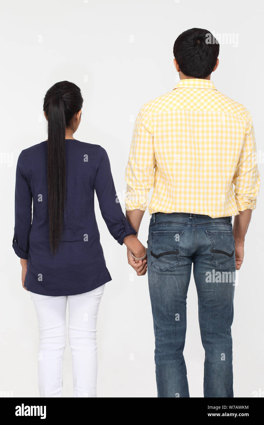 Rear view of a couple standing Stock Photo - Alamy