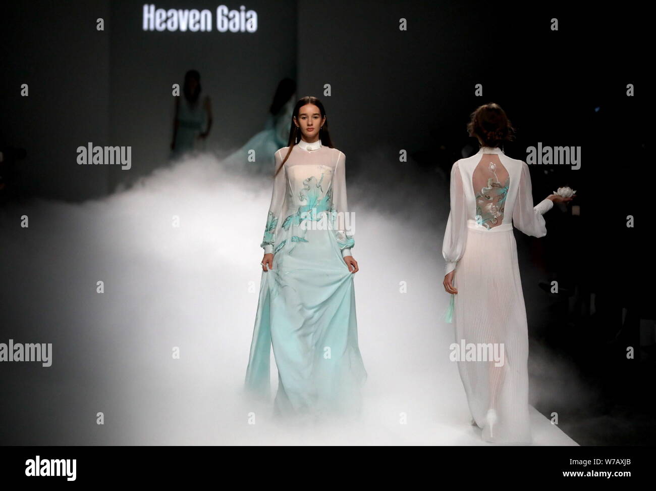 A model displays a new creation at the fashion show of Heaven Gaia ...