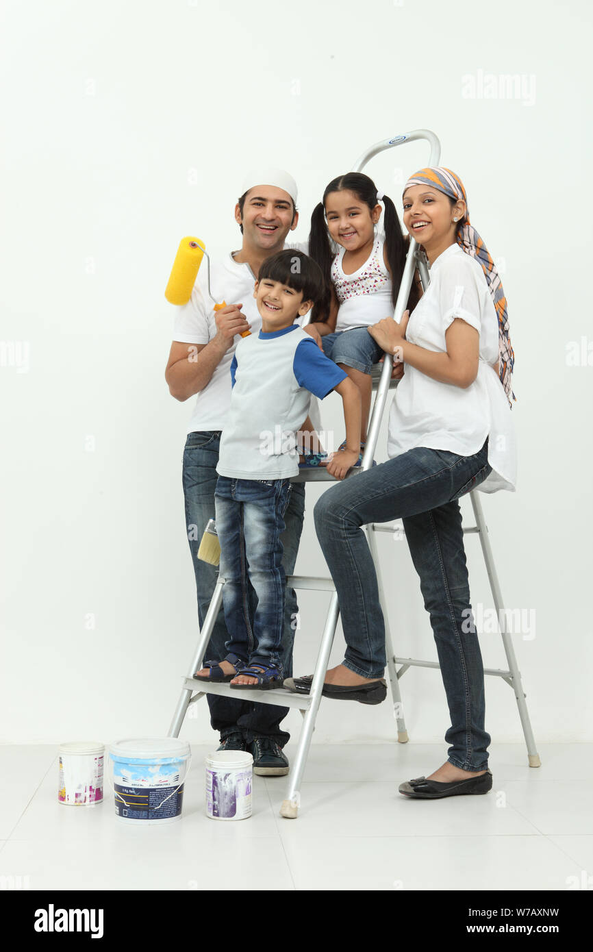 Family standing together and smiling Stock Photo - Alamy