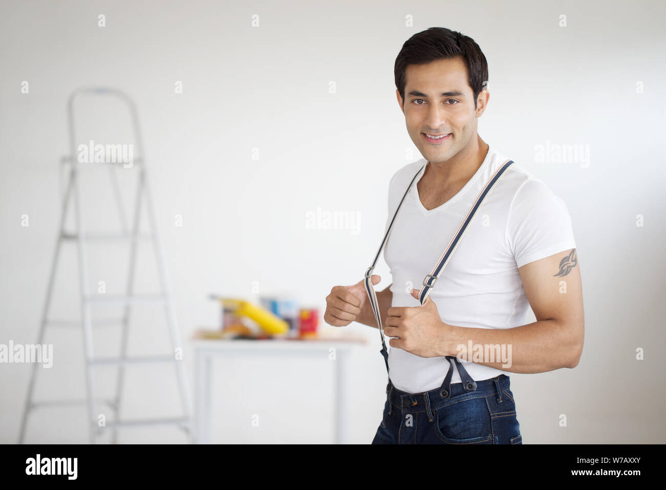 Portrait of a young man standing Stock Photo - Alamy