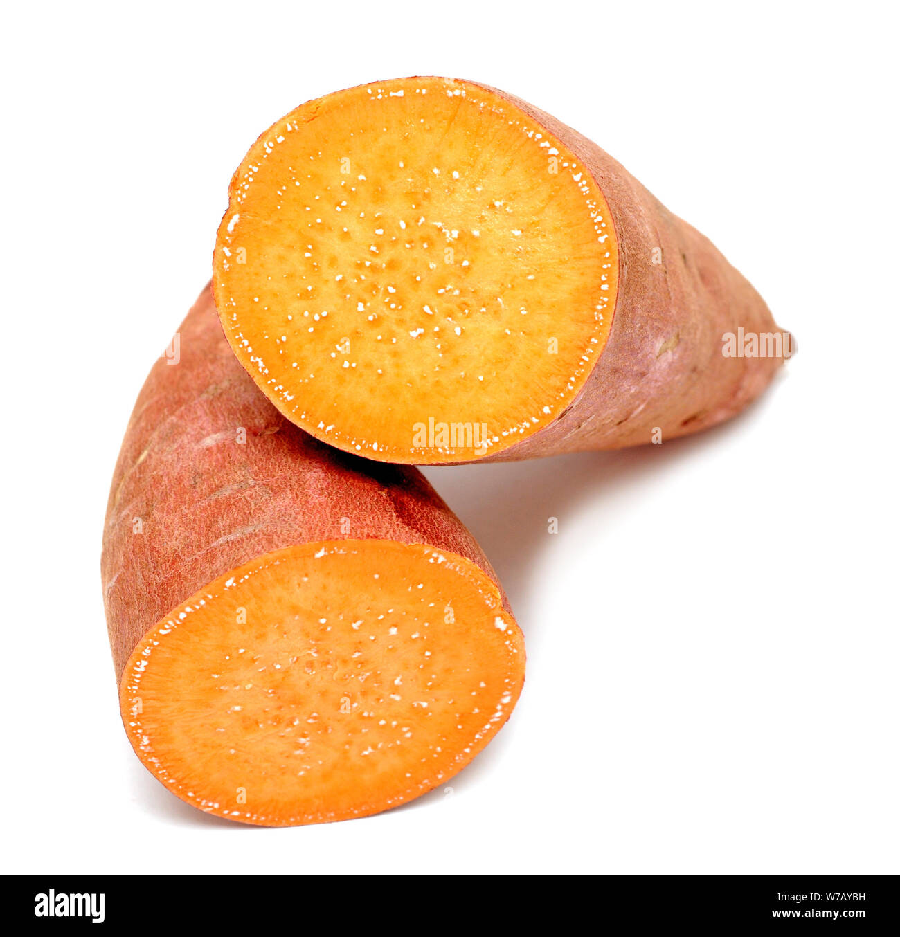 two half of sweet potato on white Stock Photo - Alamy
