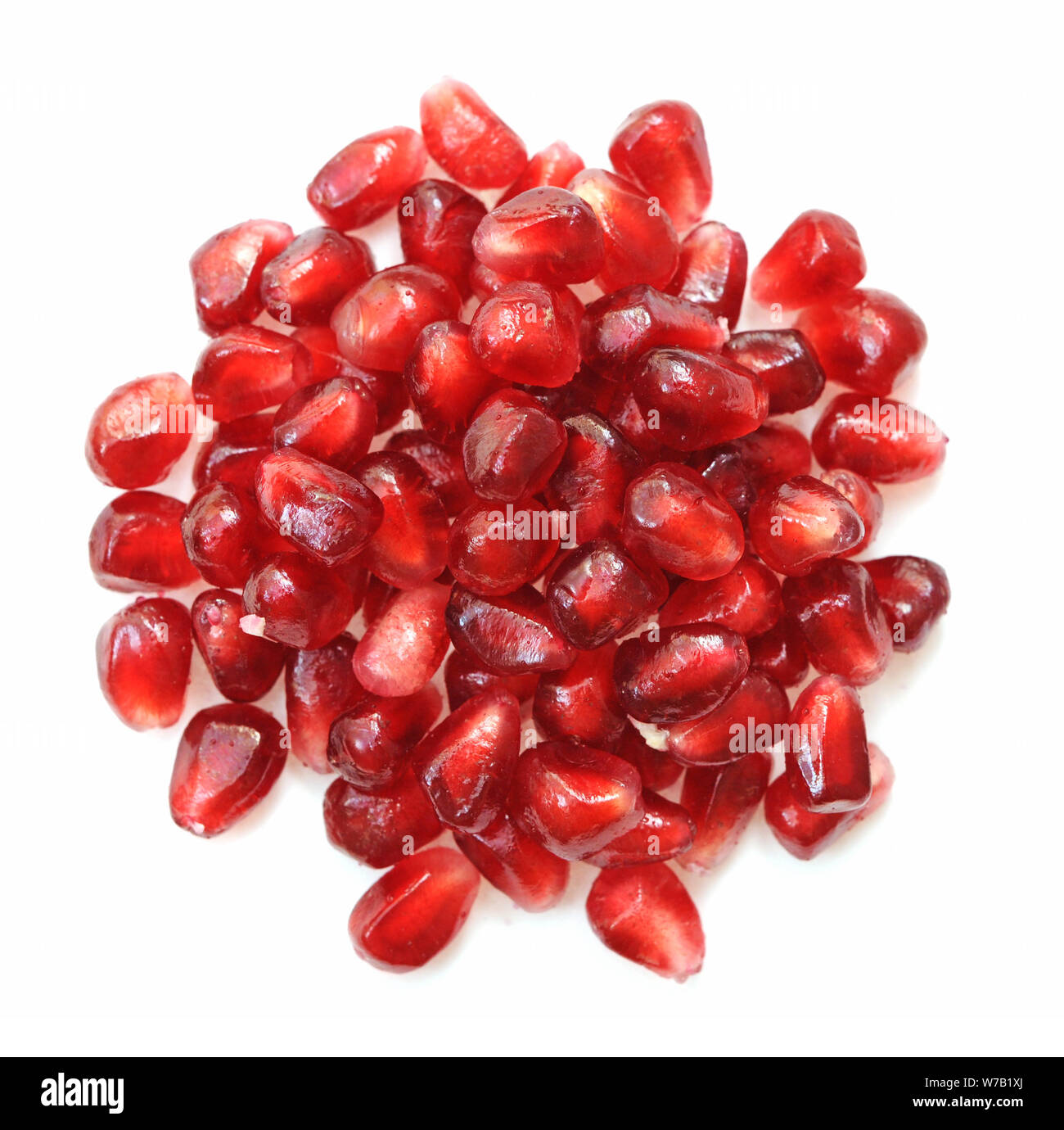 pomegranate seeds on white background Stock Photo - Alamy