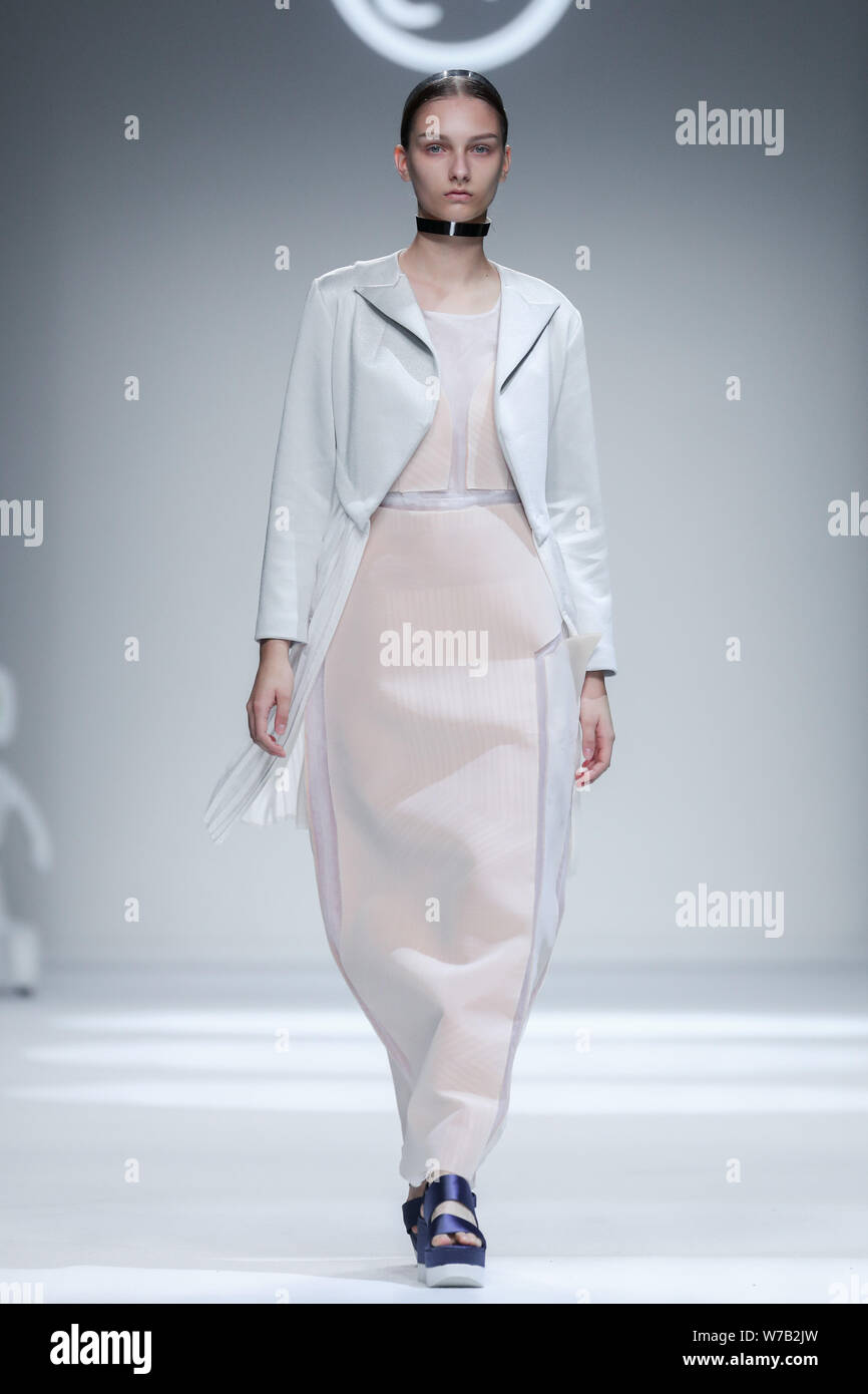 A model displays a new creation at the fashion show of AUSTIN.W. x ...