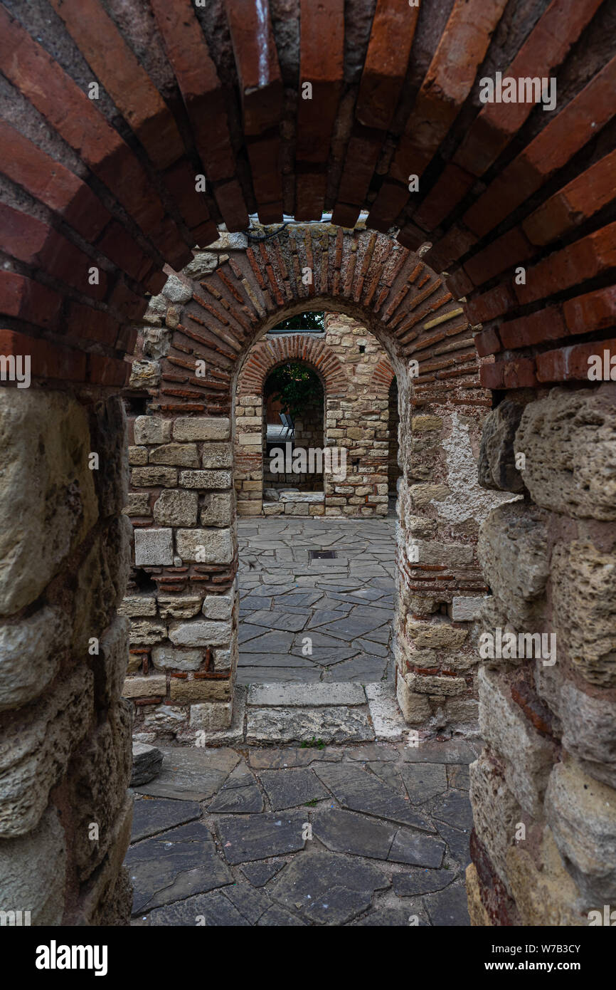 Brick arches (ancient masonry) going into the distance Stock Photo - Alamy