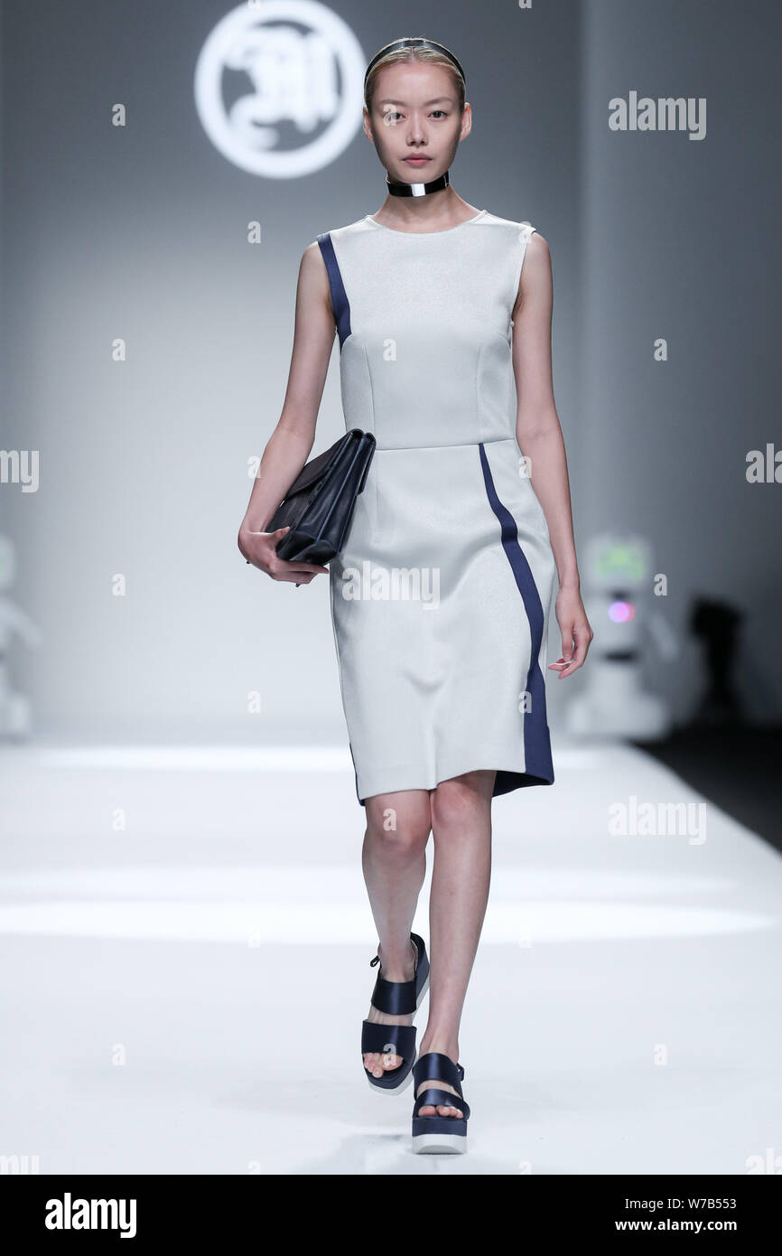 A model displays a new creation at the fashion show of AUSTIN.W. x ...