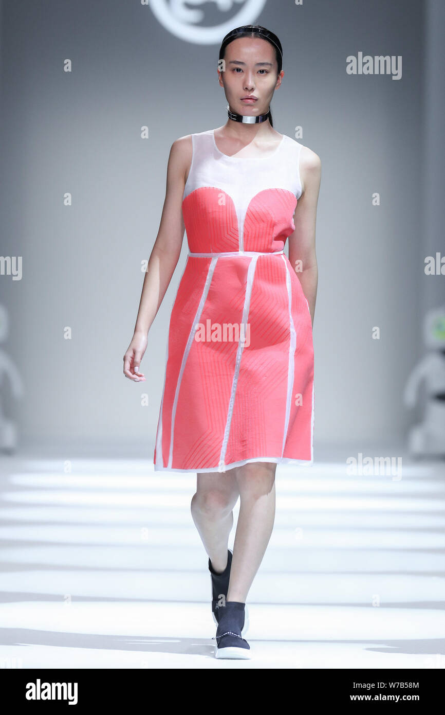 A model displays a new creation at the fashion show of AUSTIN.W. x ...