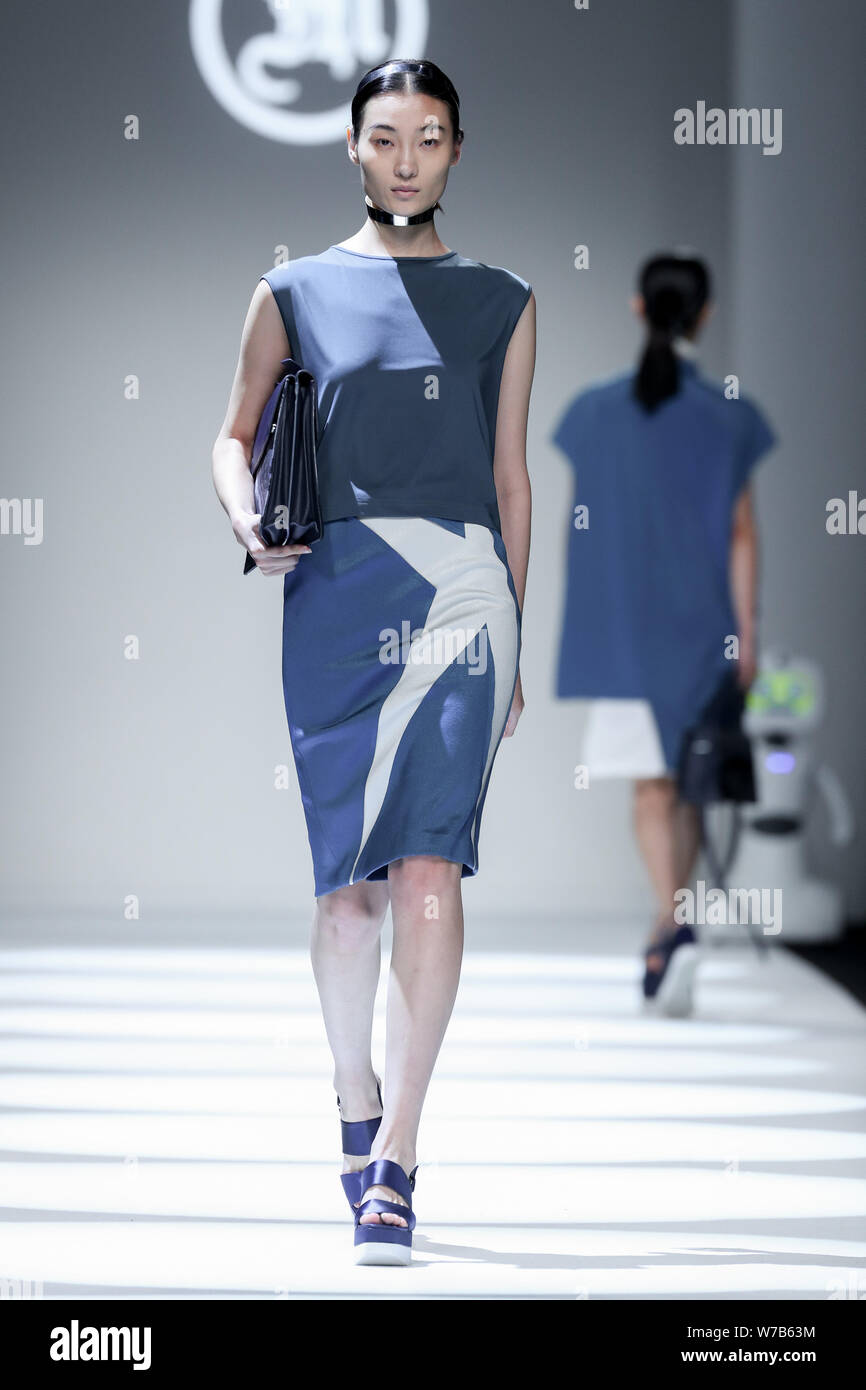 A model displays a new creation at the fashion show of AUSTIN.W. x ...