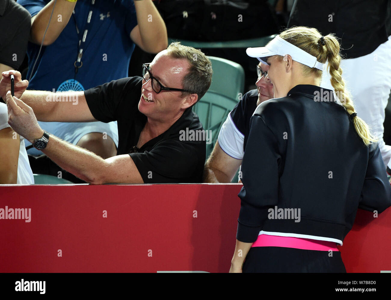 Danish tennis player Caroline Wozniacki, front right, poses for a ...