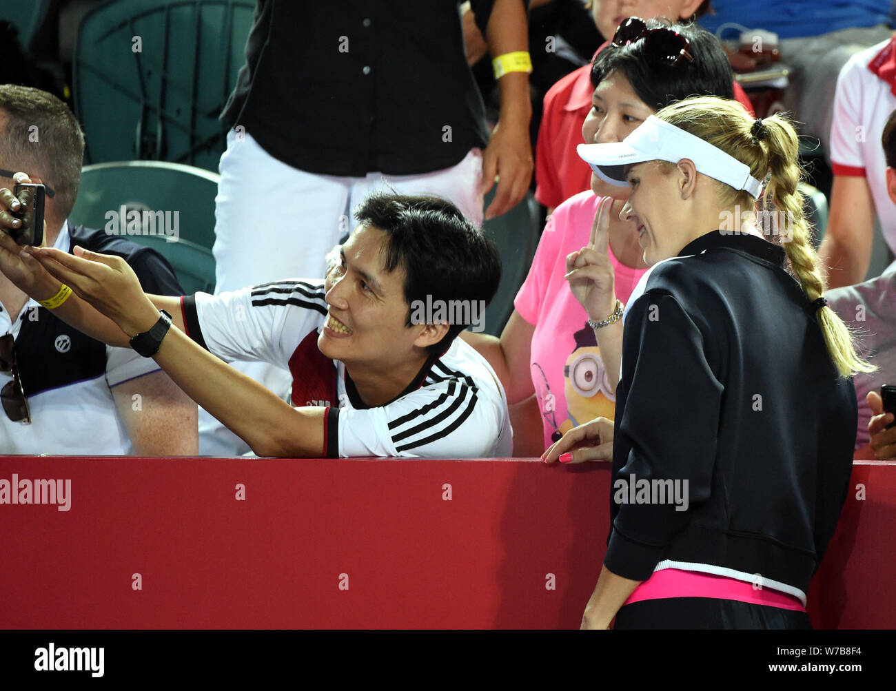 Danish tennis player Caroline Wozniacki, front right, poses for a ...