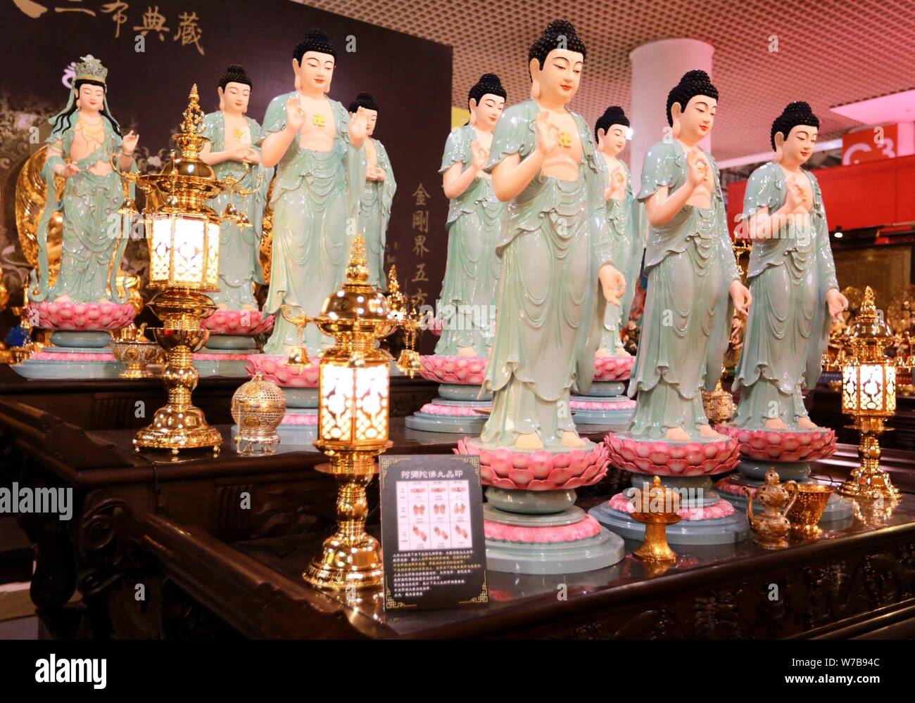 View of Buddhist statues with nine handprints on display at the 12th ...