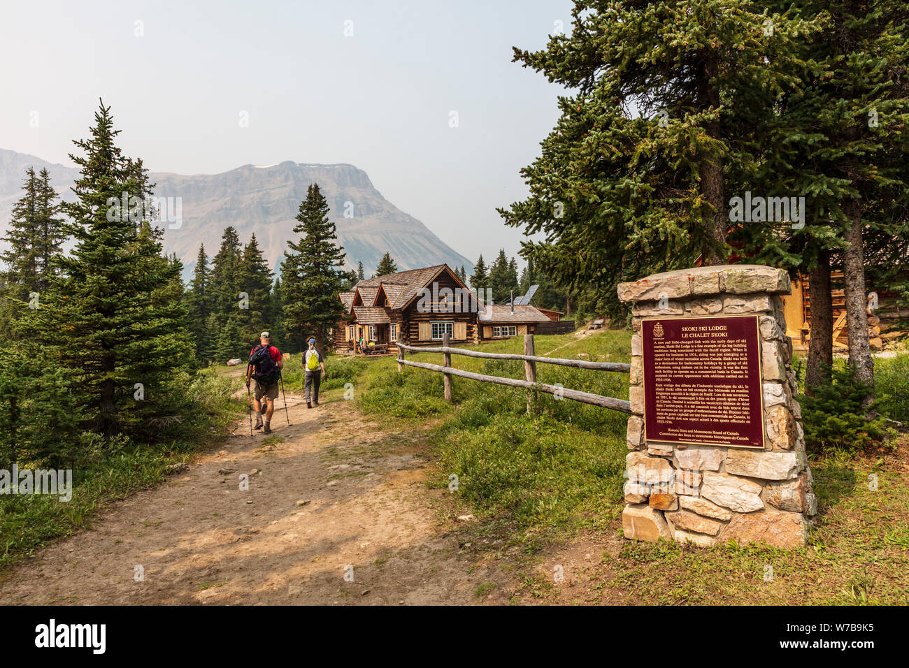 Hikers entering Skoki Ski Lodge, a remote backcountry lodge located ...