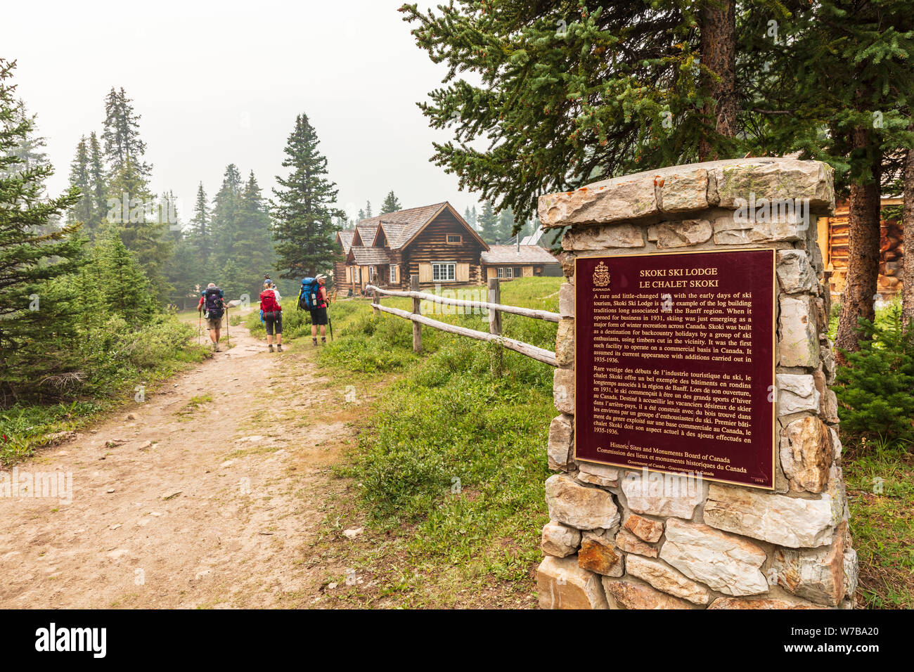 Hikers entering Skoki Ski Lodge, a remote backcountry lodge located ...