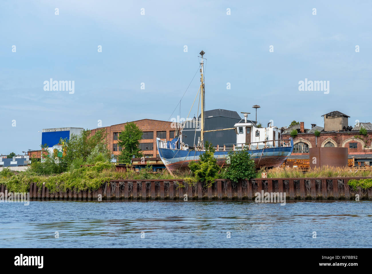 a decommissioned ship is standing ashore in an old harbour Stock Photo ...