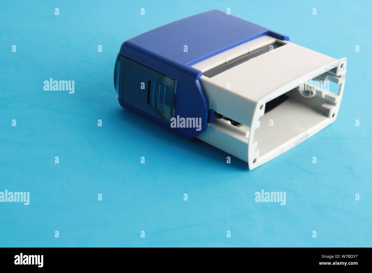 Automatic ink stamp manufactured in blue plastic Stock Photo - Alamy