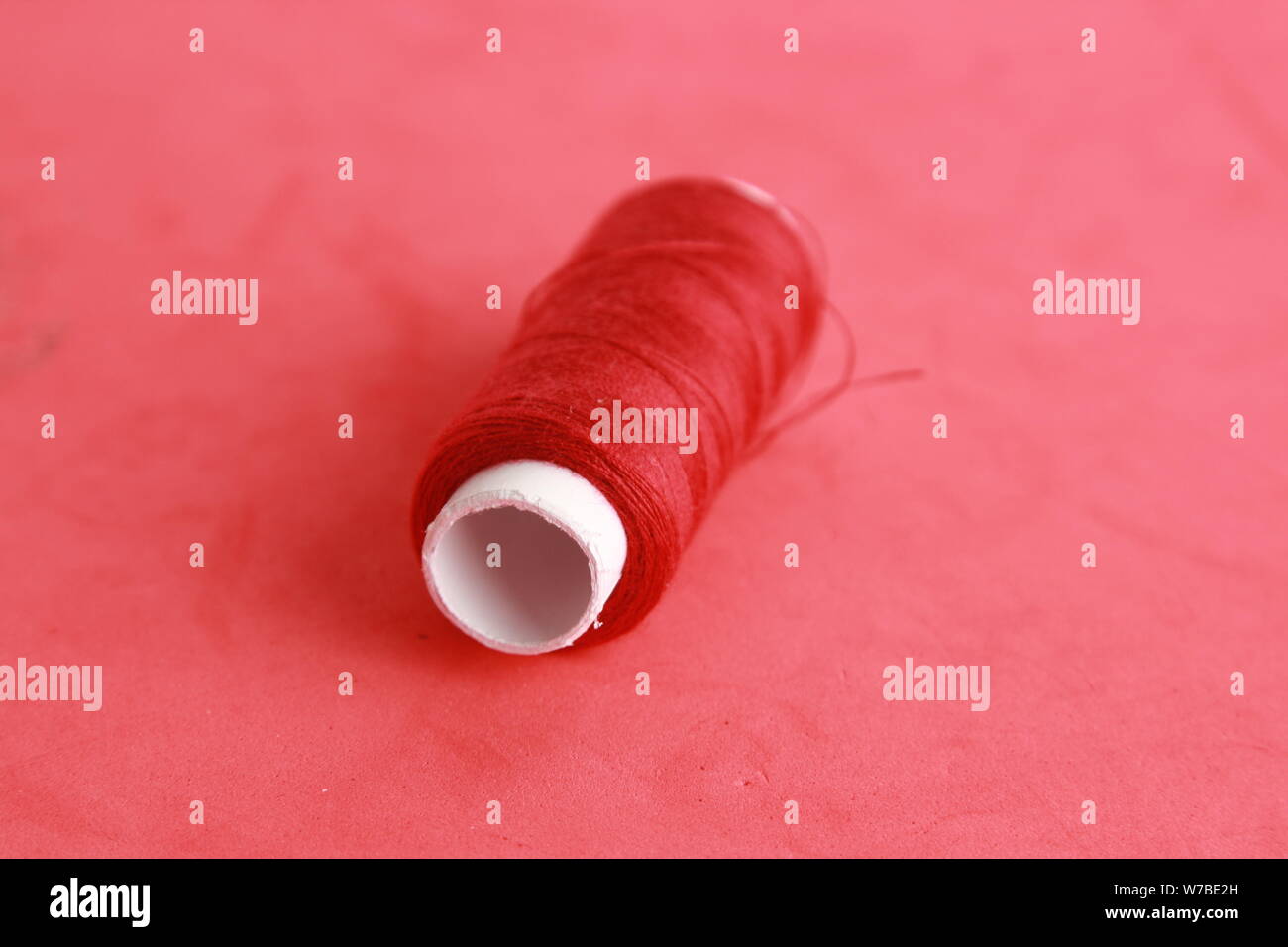 sewing thread red clothes Stock Photo - Alamy