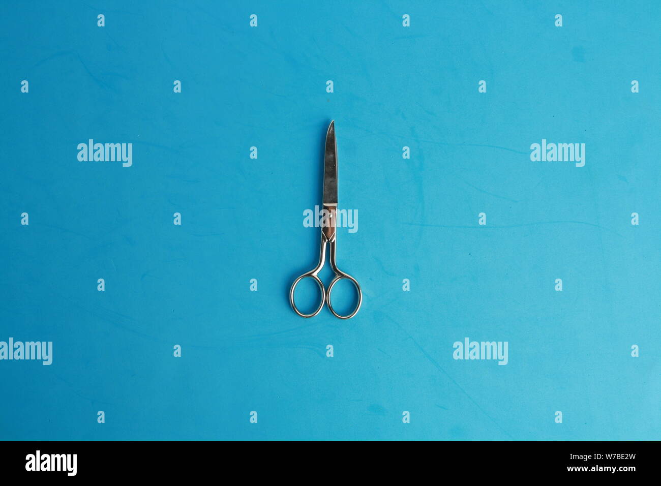 sewing scissors on colorful background Stock Photo - Alamy