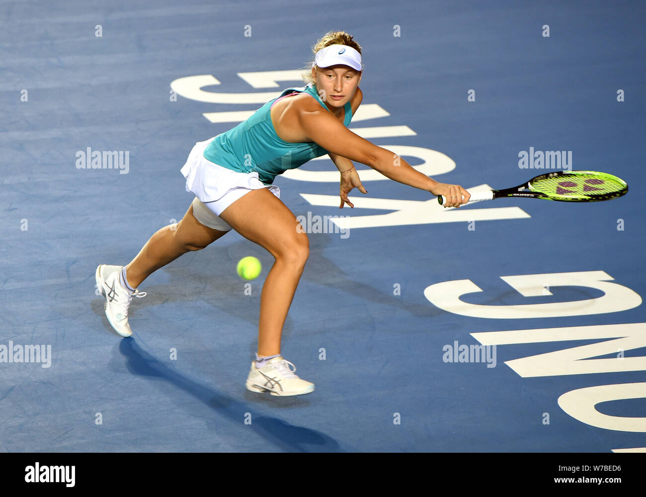 Daria Gavrilova of Australia returns a shot to Anastasia Pavlyuchenkova ...
