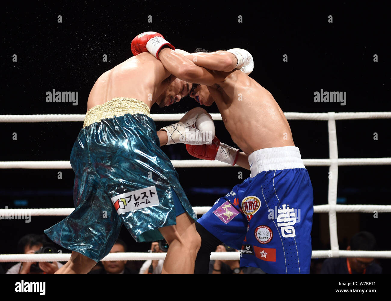 Rex Tso Sing-yu of Hong Kong, left, competes against Kohei Kono of ...