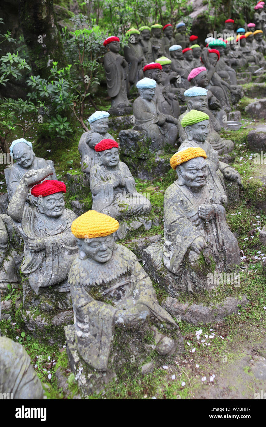 Stone Ksitigarbha statues (Jizo Bosatsu) in a knitted hats, Daishouin ...