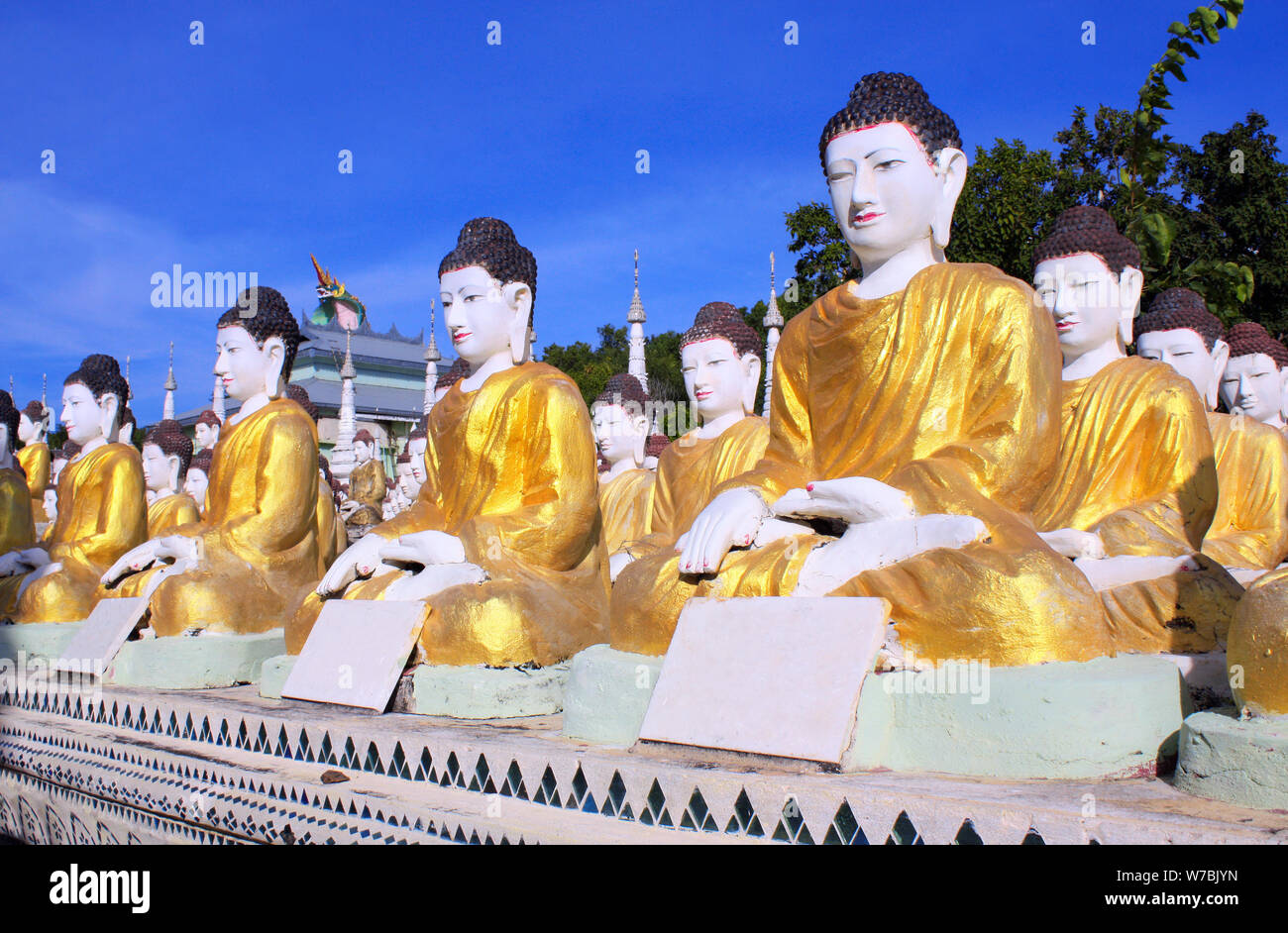 Rows of old stone statues of Buddha, Aung Setkya Paya, near to famous ...