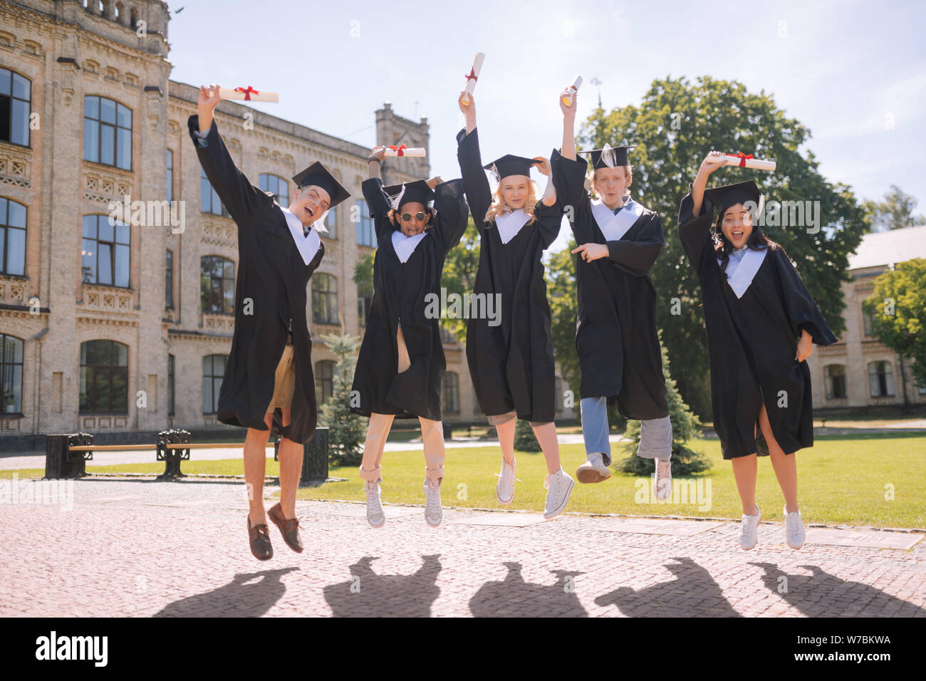 Students being excited graduating the university together Stock Photo ...