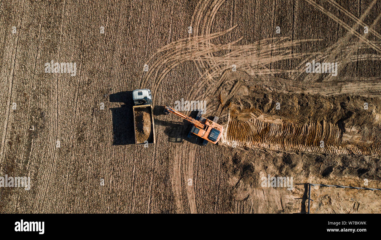 Excavator loads truck aerial hi-res stock photography and images - Alamy