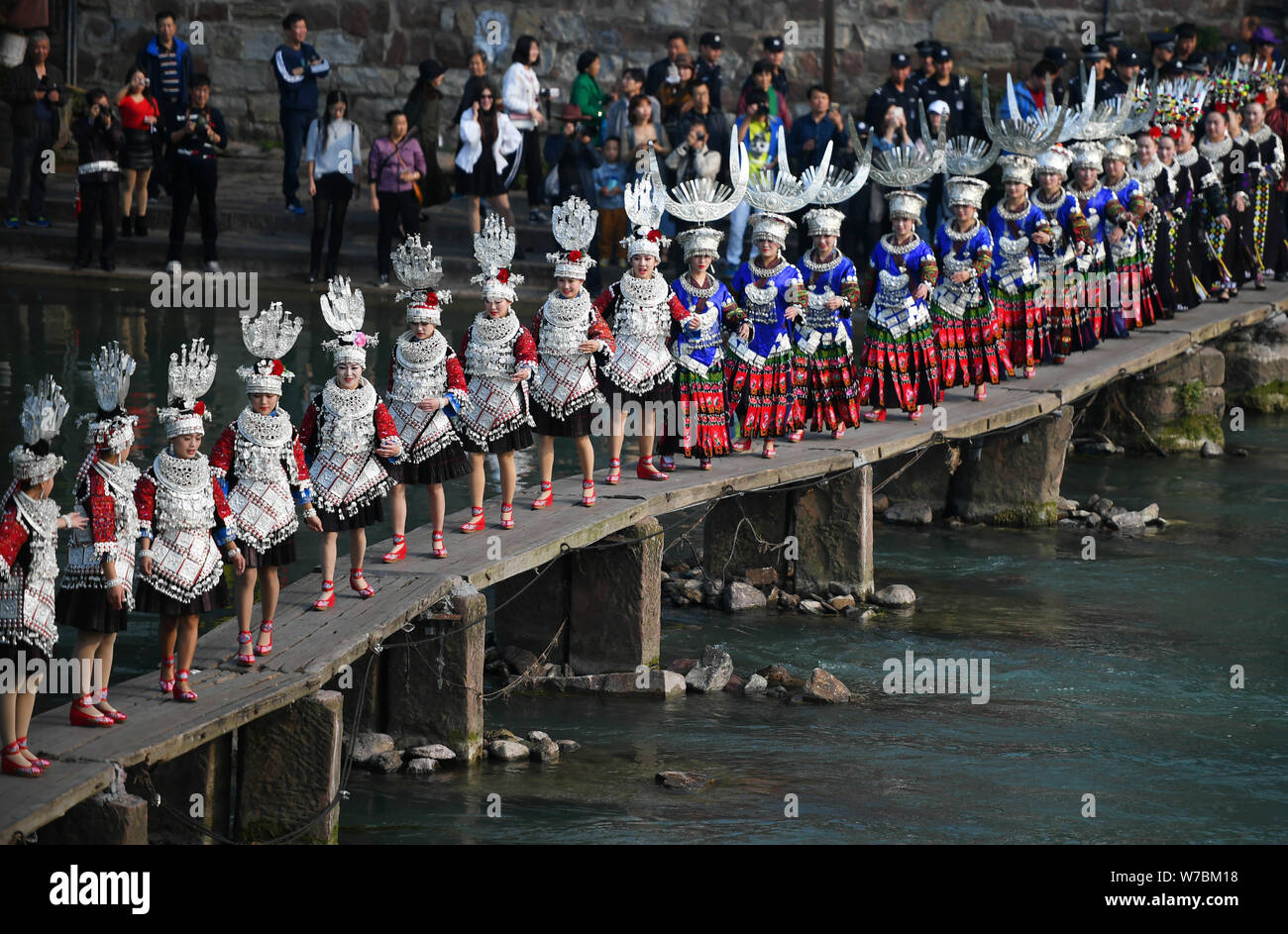 Chinese girls of Miao ethnic minority dressed in traditional silver ...
