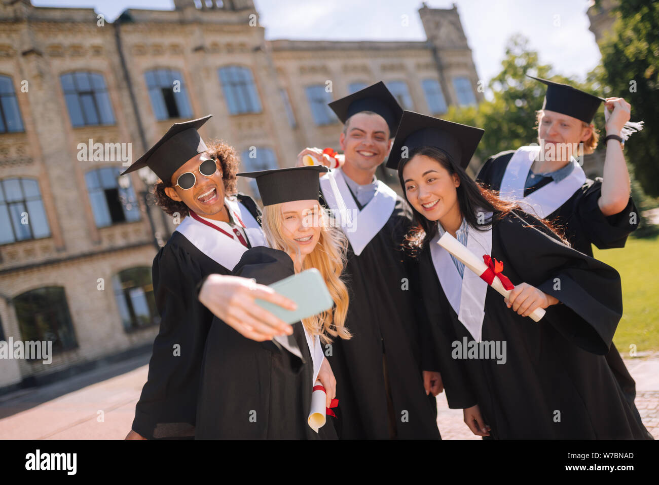 Young students graduation ceremony hi-res stock photography and images ...