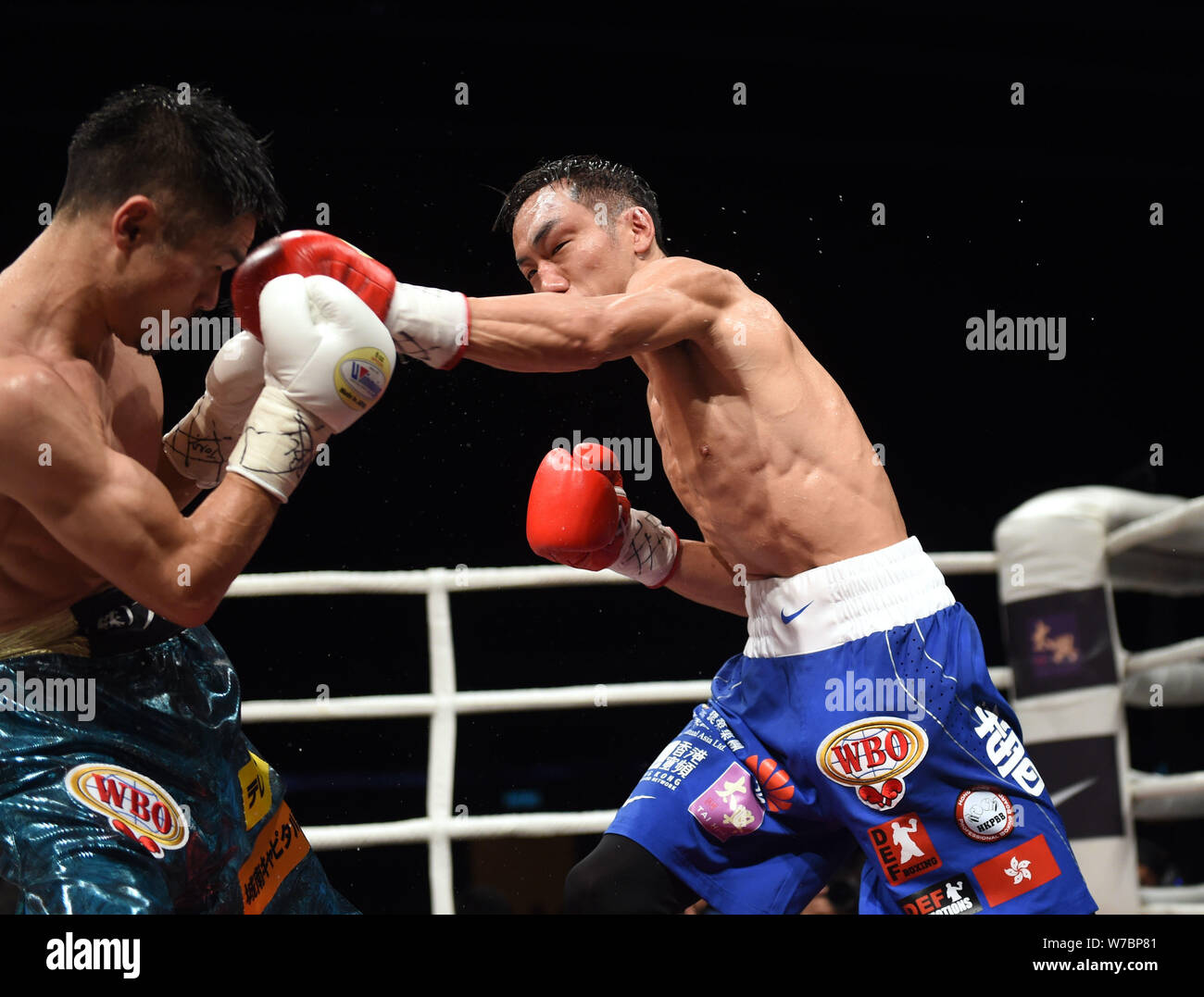 Rex Tso Sing-yu of Hong Kong, right, competes against Kohei Kono of ...
