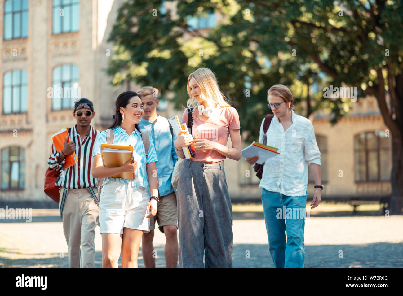 Group of students going home after classes Stock Photo - Alamy